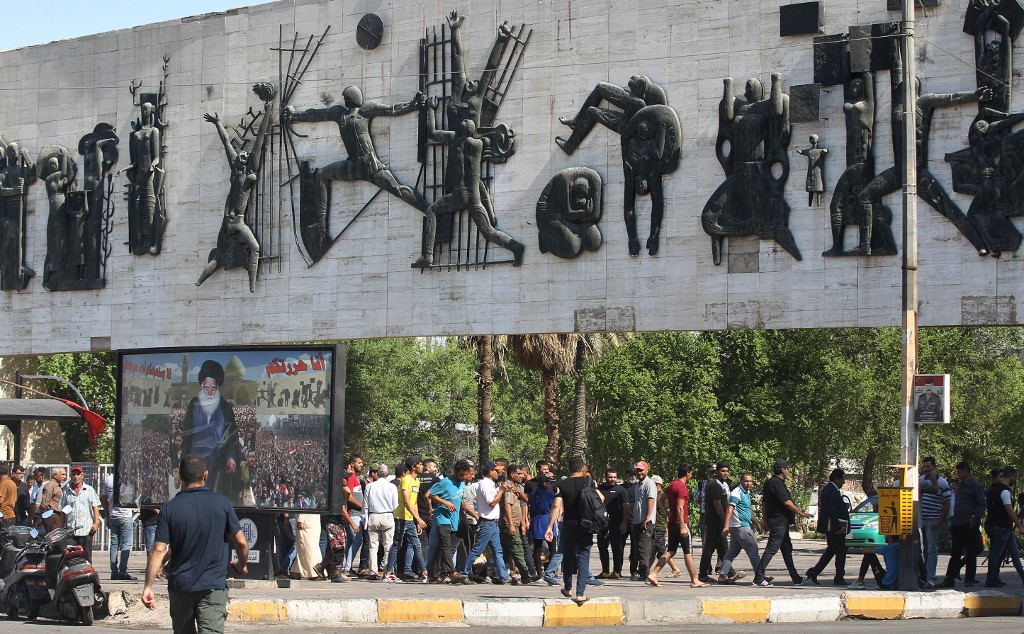 Protesters flood Iraq streets anew as death toll nears 100