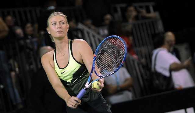 Sharapova back in business, like it or not